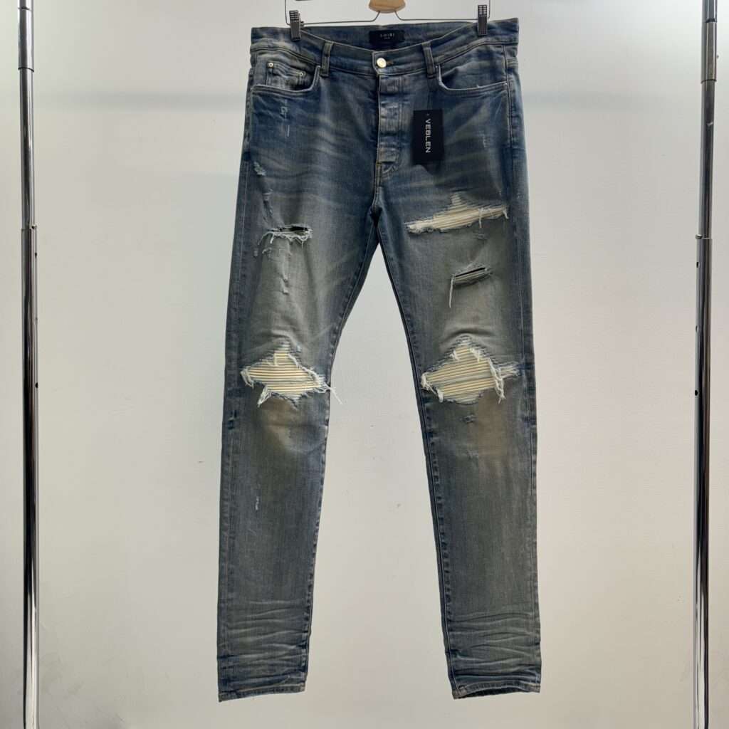 Amiri Distressed Leather Patch Jeans - Veblen